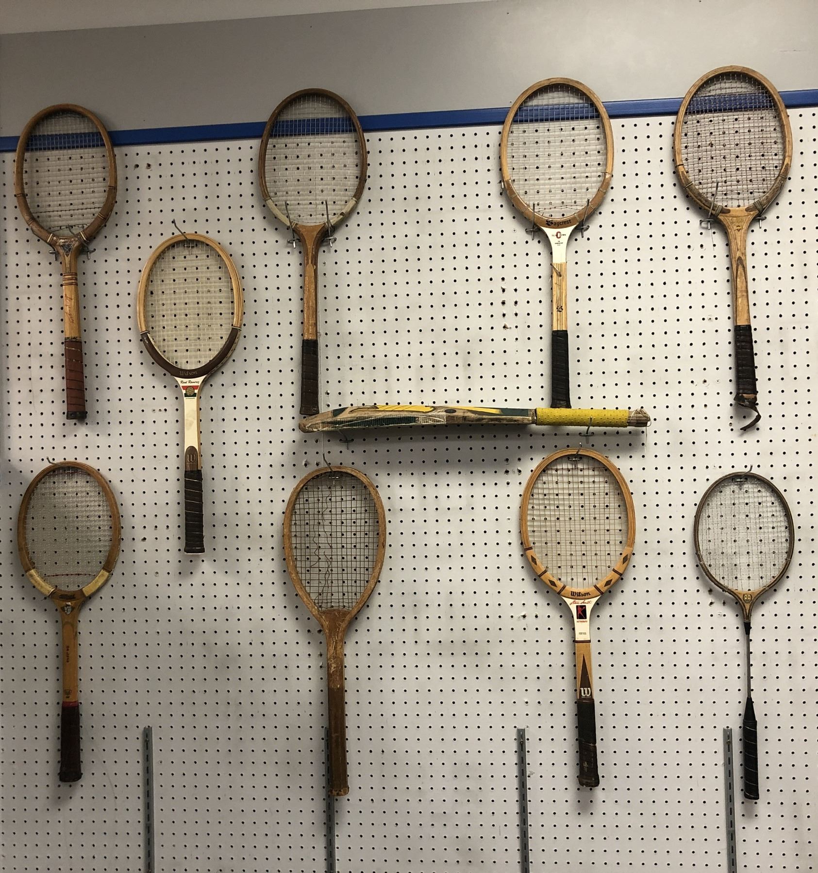 Large group of assorted vintage rackets and cricket bat