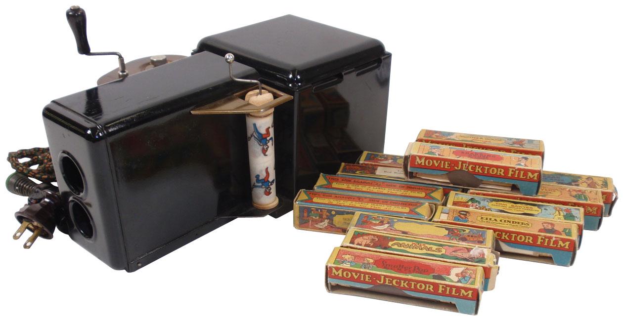 Toy movie projector w/12 films, mfgd by Jecktor Co., includes Red ...