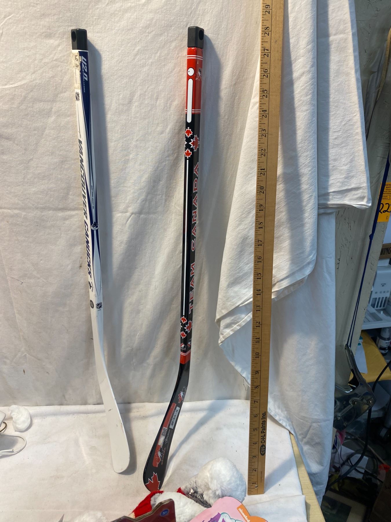 Two mini sticks team Canada And Vancouver Canucks
