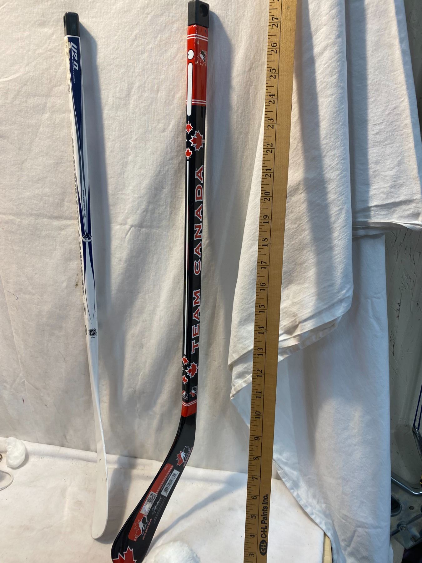 Two mini sticks team Canada And Vancouver Canucks
