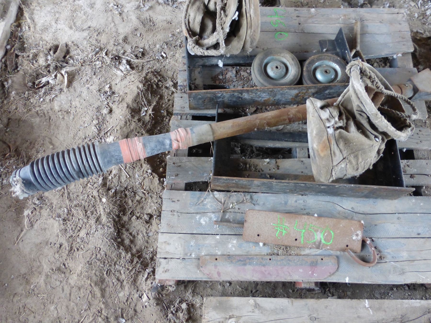 White railing, metal, wheels, expanded metal, old water pump
