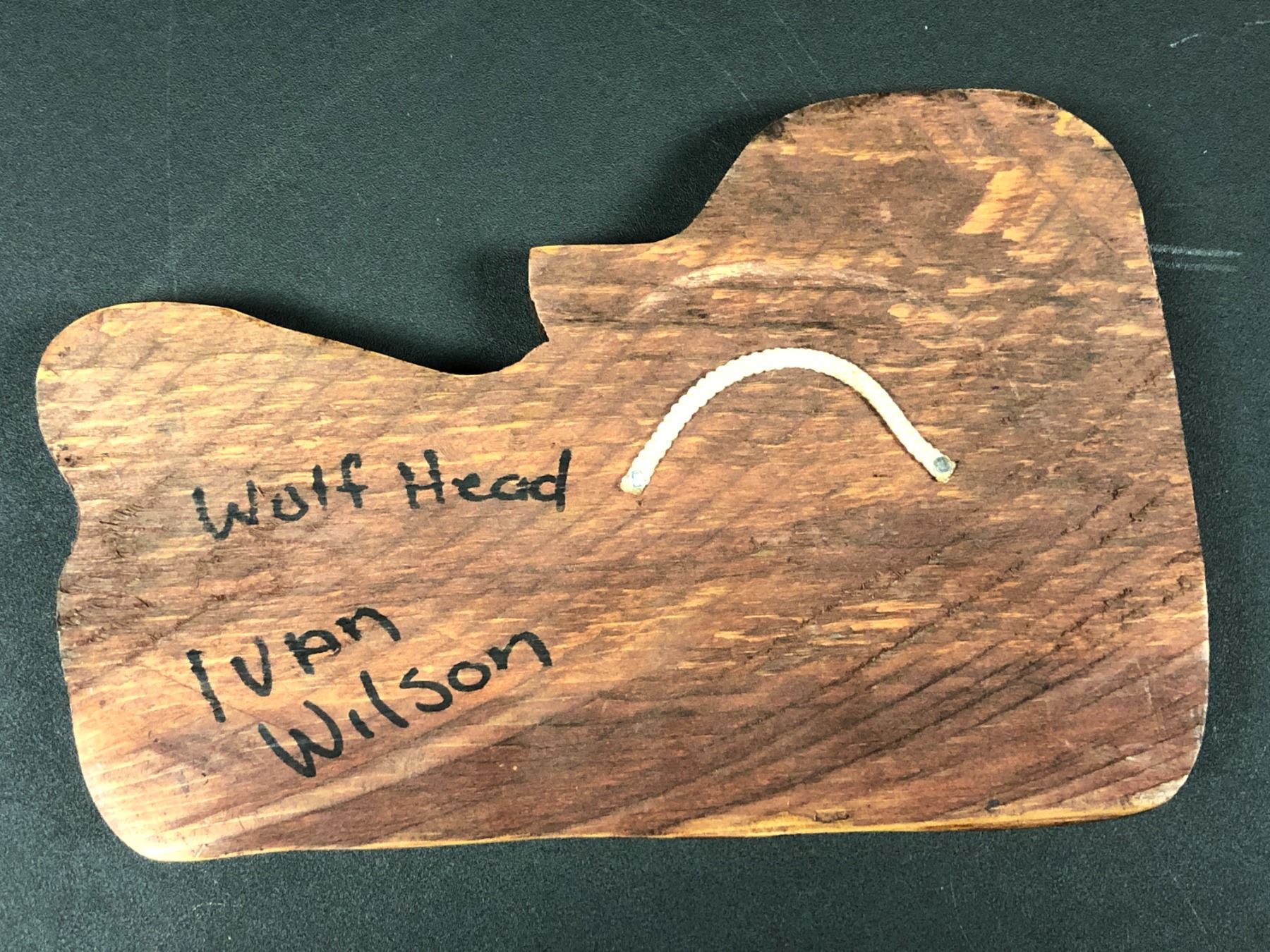 First Nations decorative wood carved wolf head signed by artist Ivan Wilson