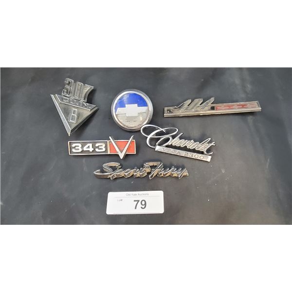 SIX VINTAGE CAR EMBLEMS six-vintage-car-emblems