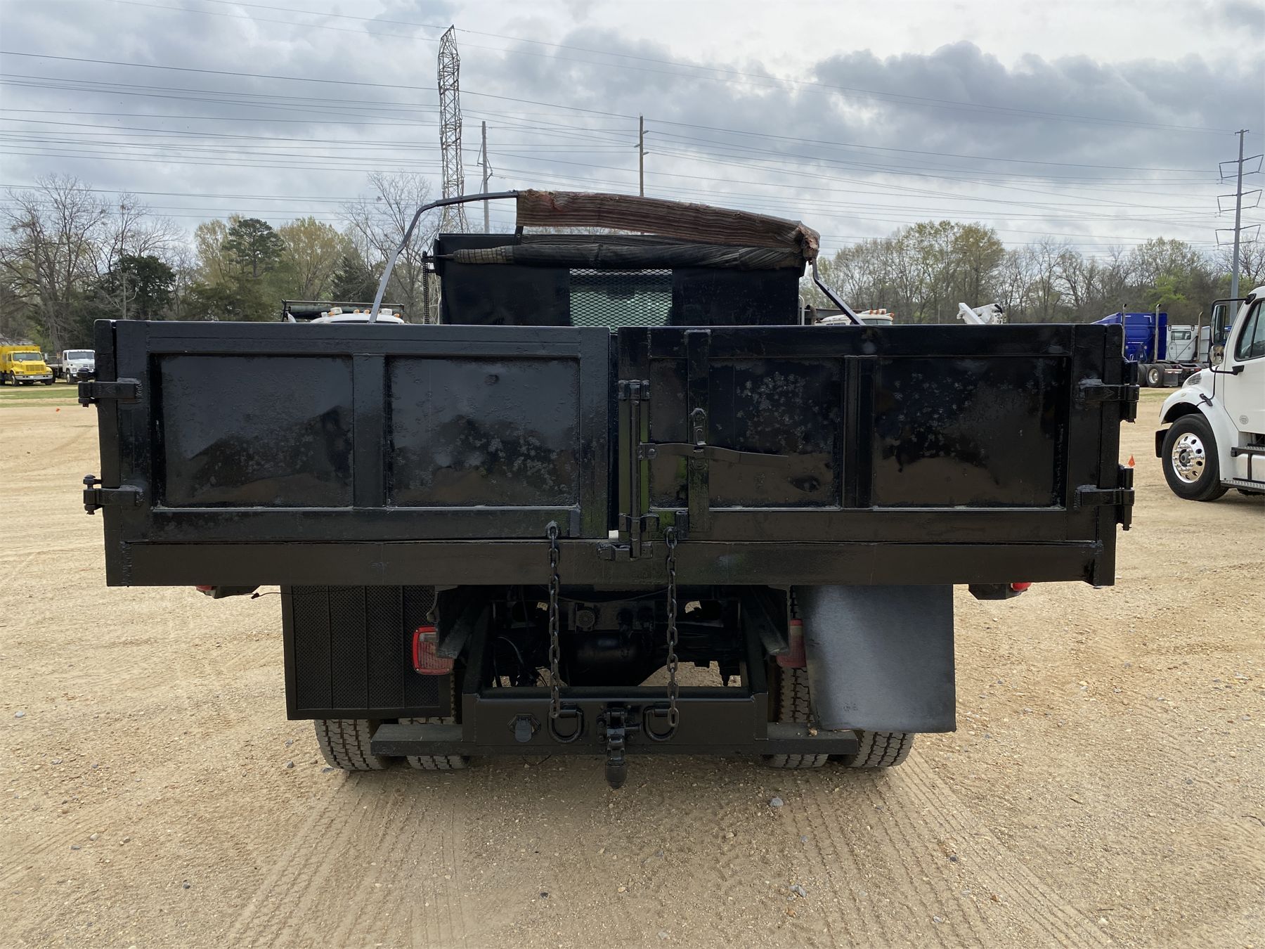 2011 FORD F750 Flatbed Dump Truck - J.M. Wood Auction Company, Inc.