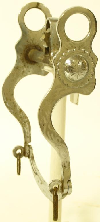 Crockett Renalde silver mounted half breed bit.