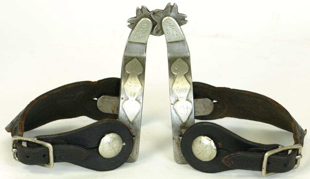 Pair of short shank silver mounted Crockett spurs