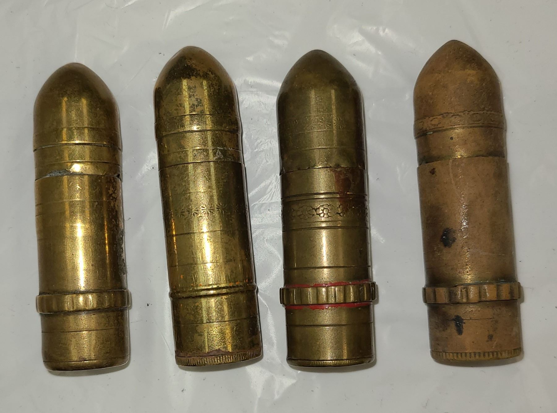 Vintage Bullet Shape Lighters in Brass - Four Lighters various makers