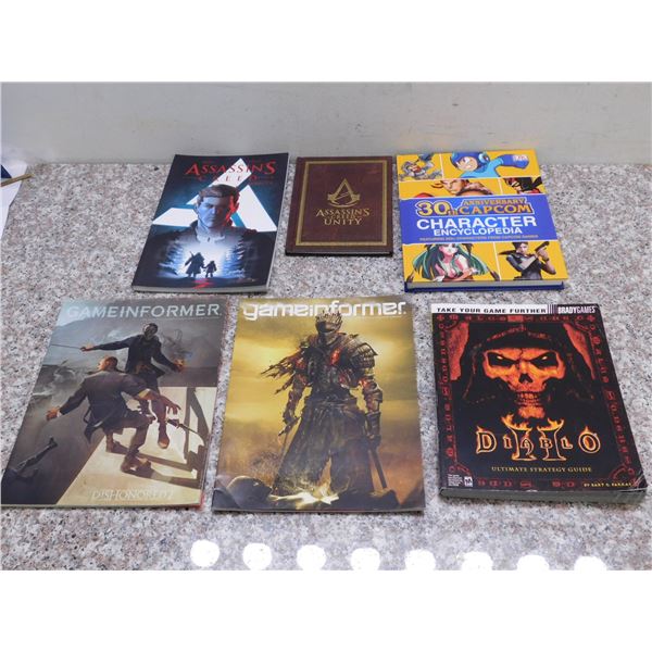 Lot of 6 Game Informer Books, 30th Capcom Encyclopedia, Assassins Creed ...