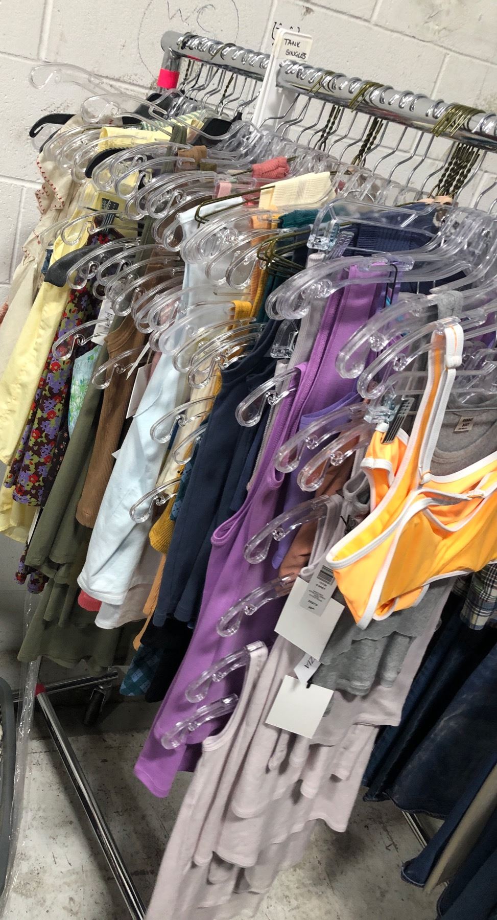 Rack of assorted wardrobe - includes bikini sets / tank tops ...