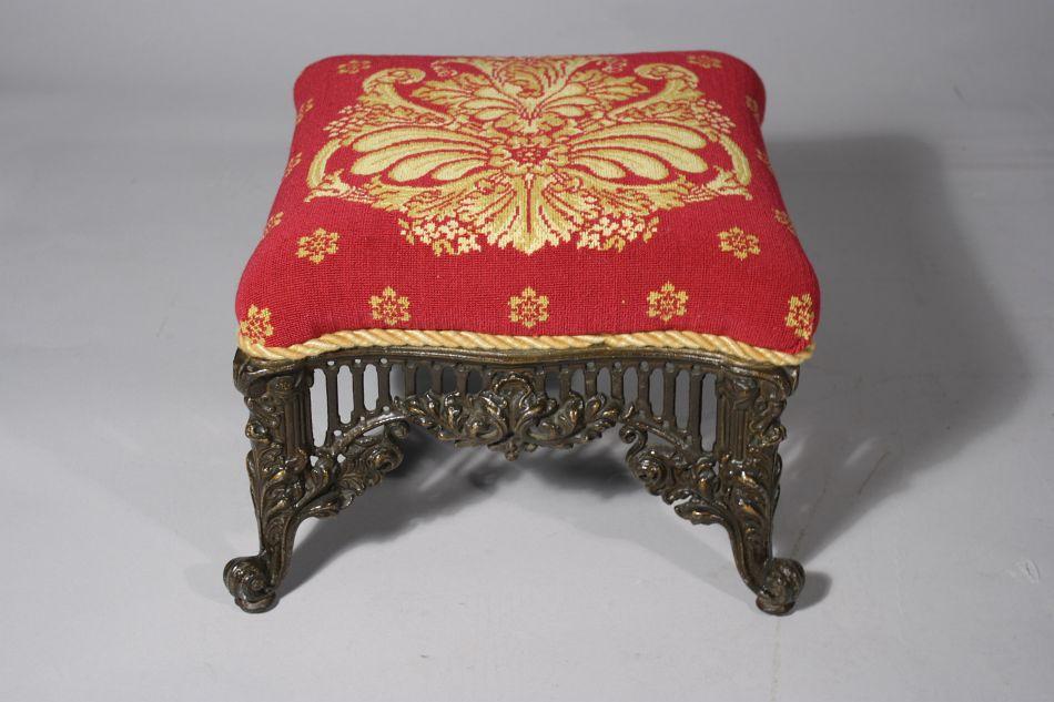 A Victorian Style Cast Iron Foot Stool, 20th Century.