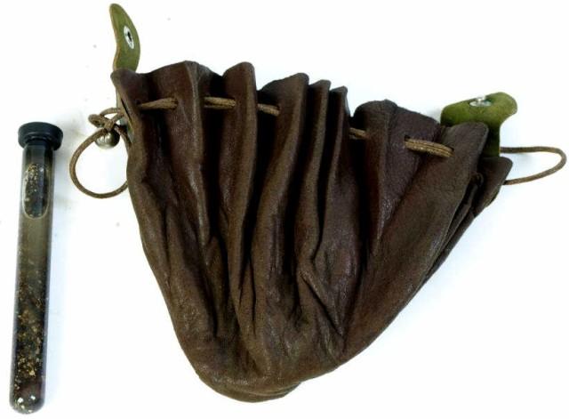 Leather gold poke bag with specimen vial sample.