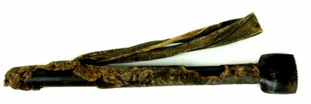 Early gun barrel hide scraper measuring 14 1/2"