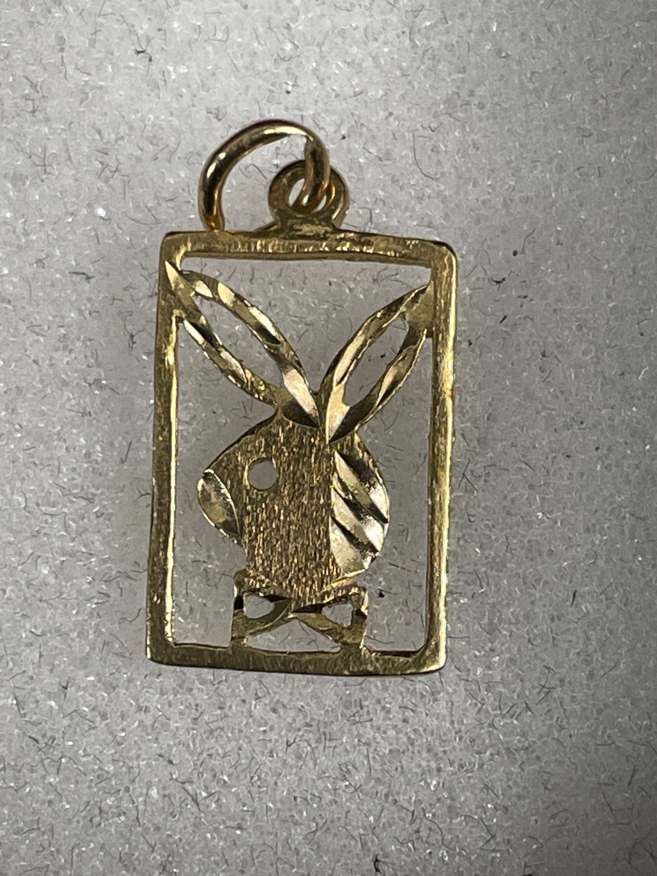 A Gold Playboy Pendant