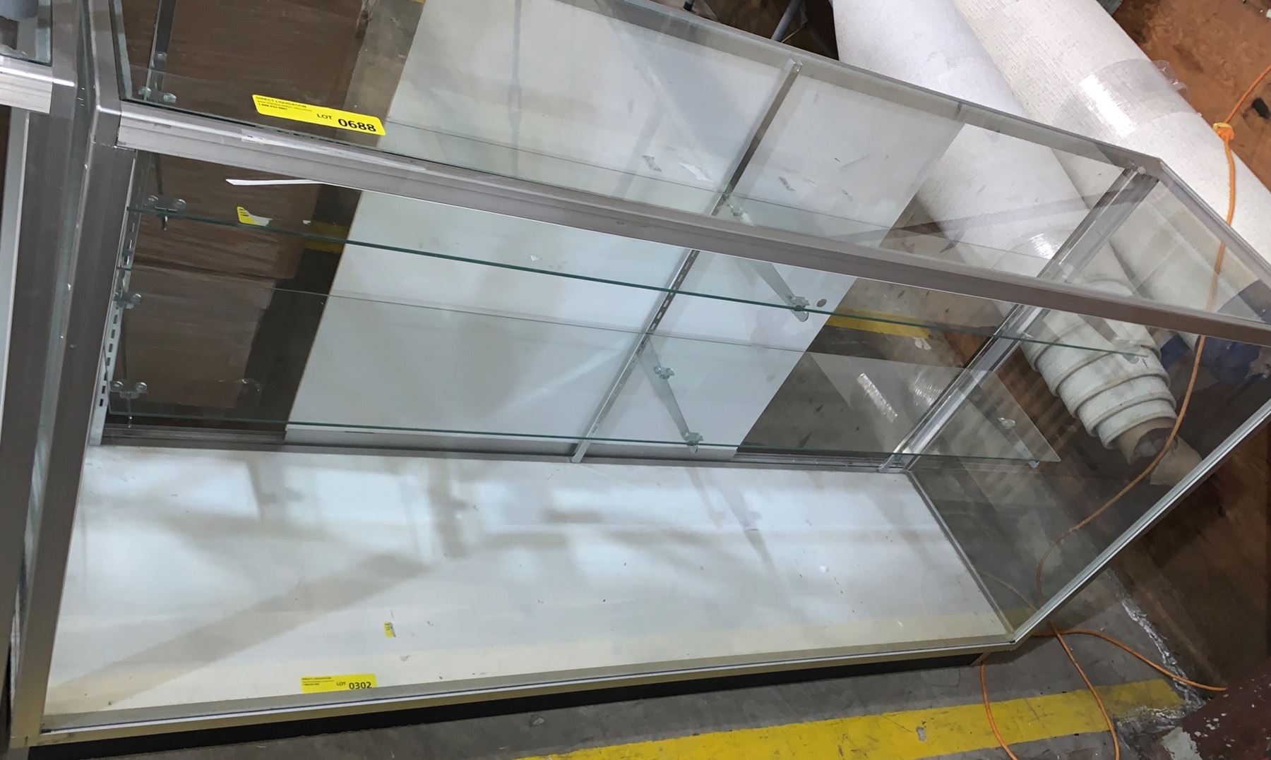 Glass Showcase w/Two Shelves and One Door 70in. W