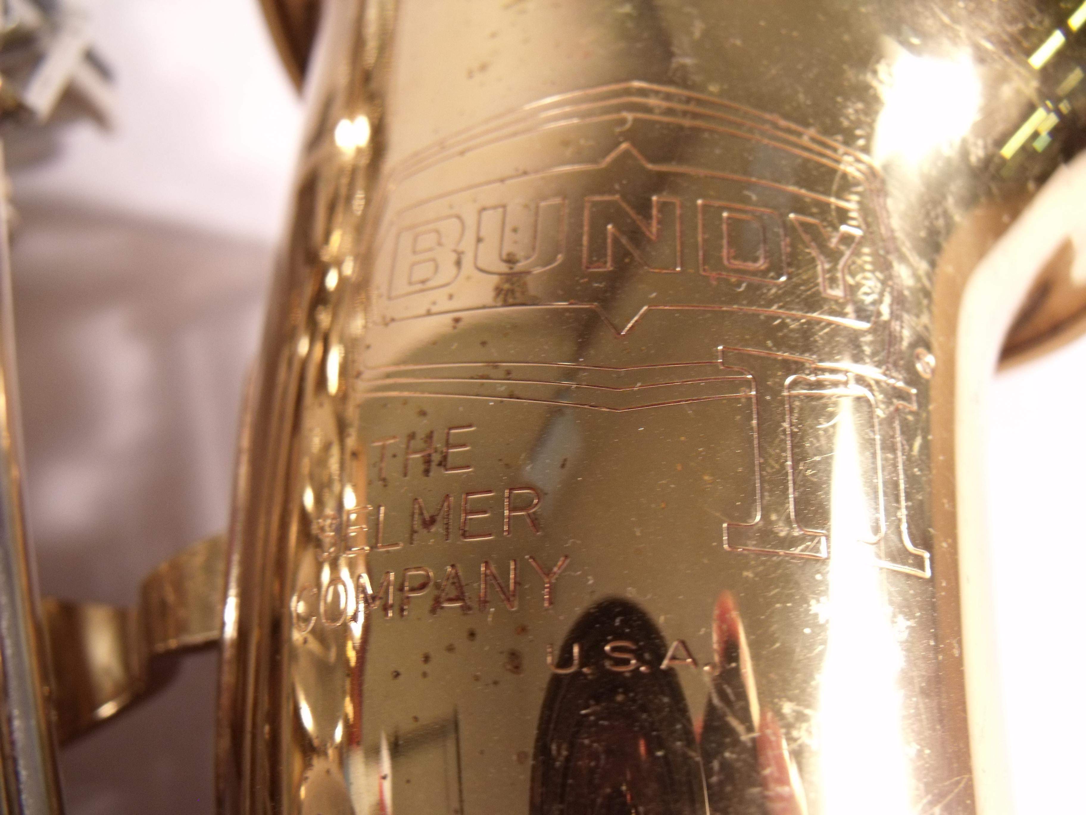 A Selmer Bundy II Brass and Chrome Alto Saxophone.