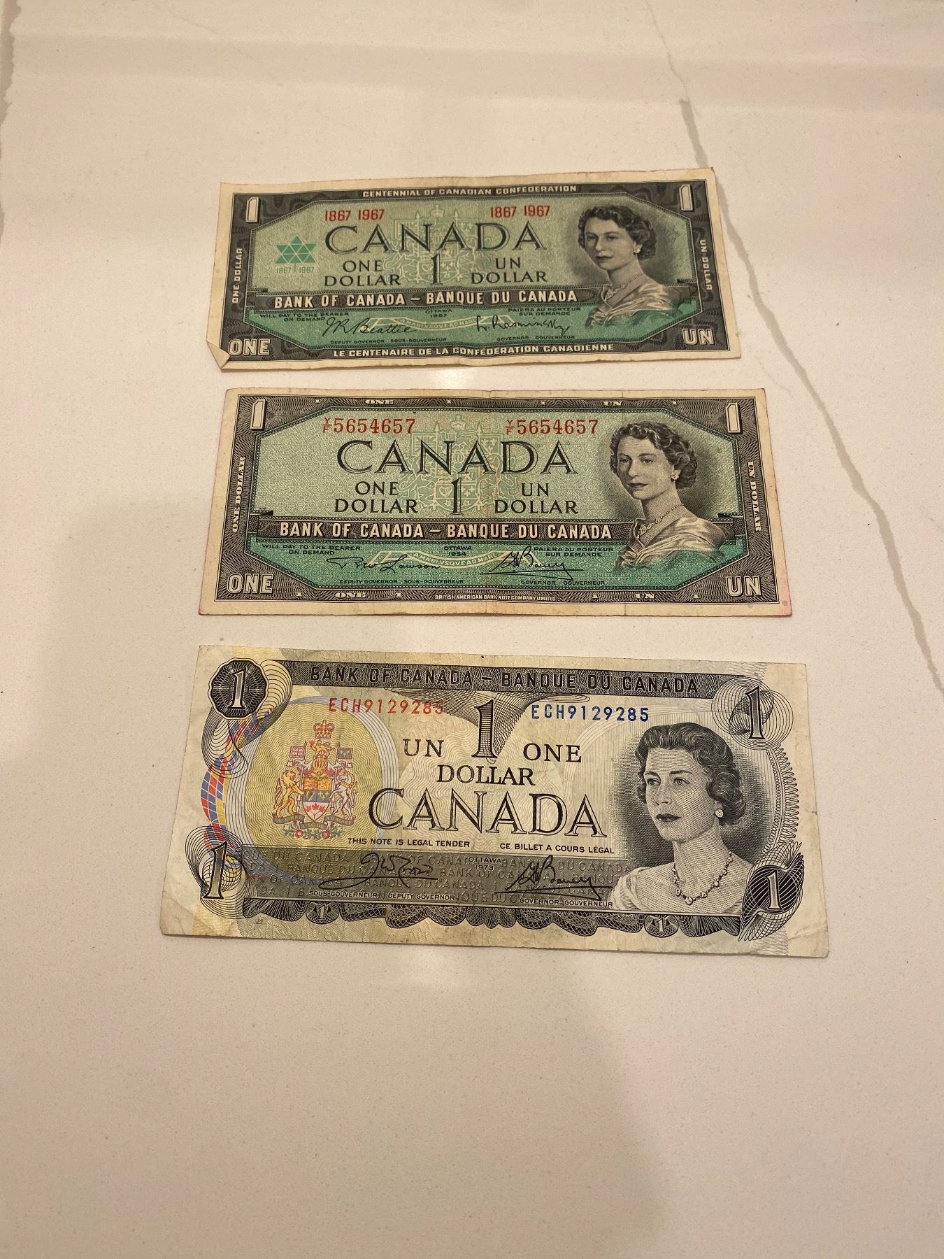 3x Canada $1 bills