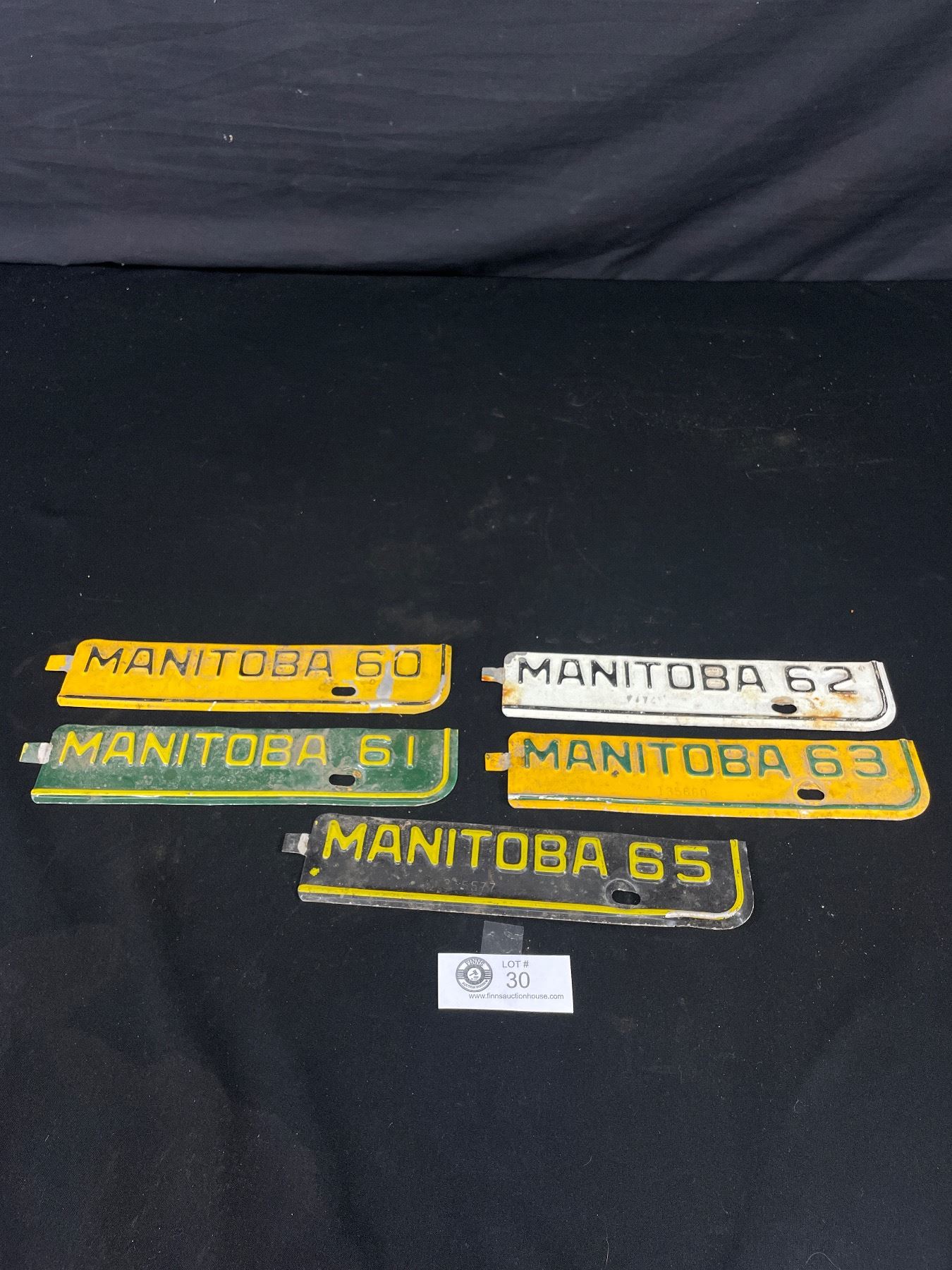 A Nice Lot of Manitoba License Plate Tabs