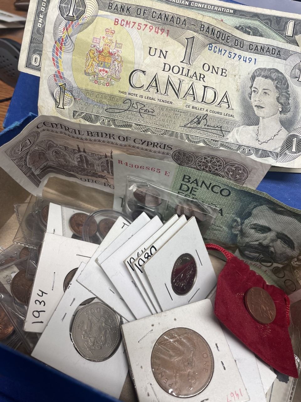 Blue Coin Collection Box with Paper Money and Old Coins