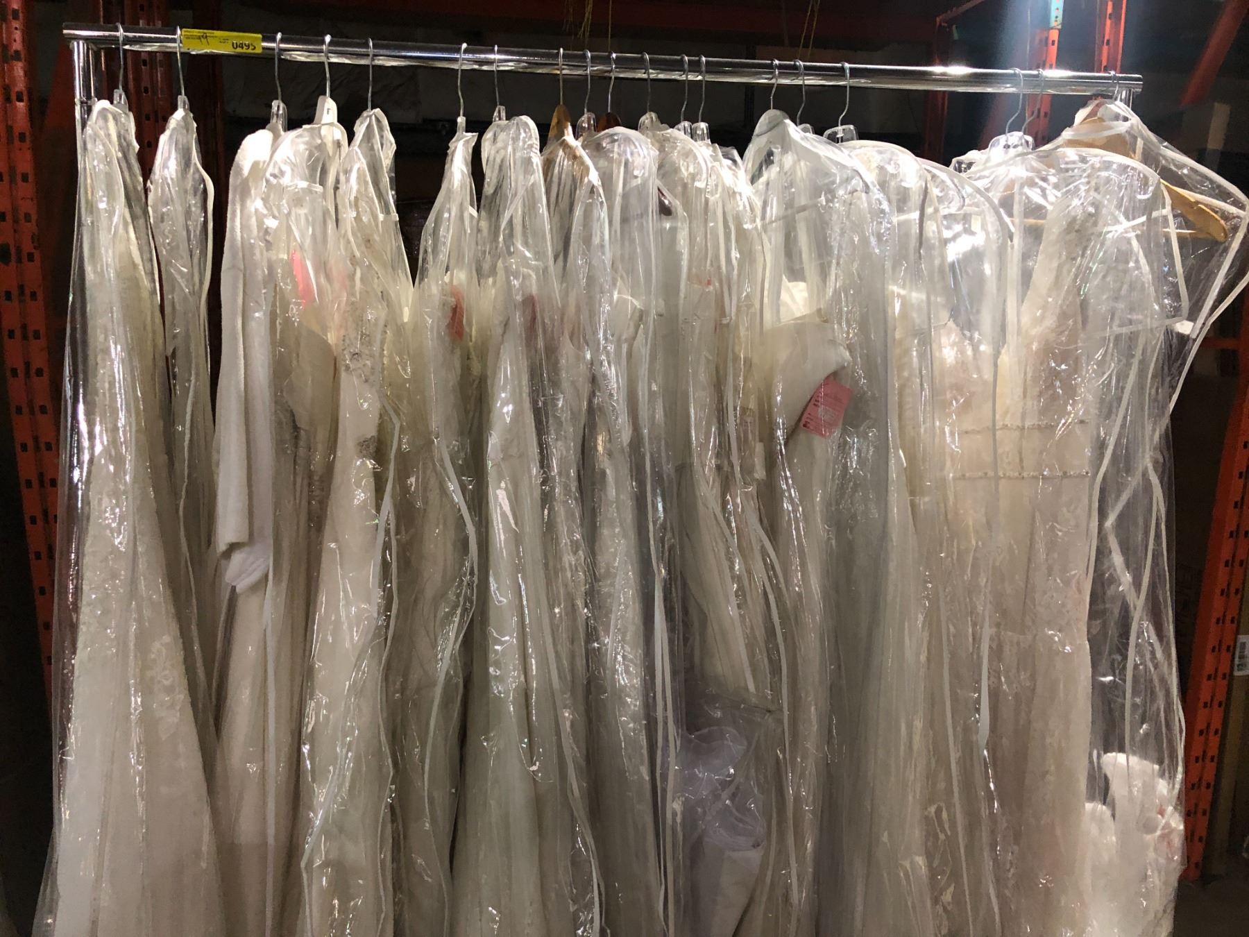 Rack full of assorted wedding dresses/ gowns from wedding store closure ...