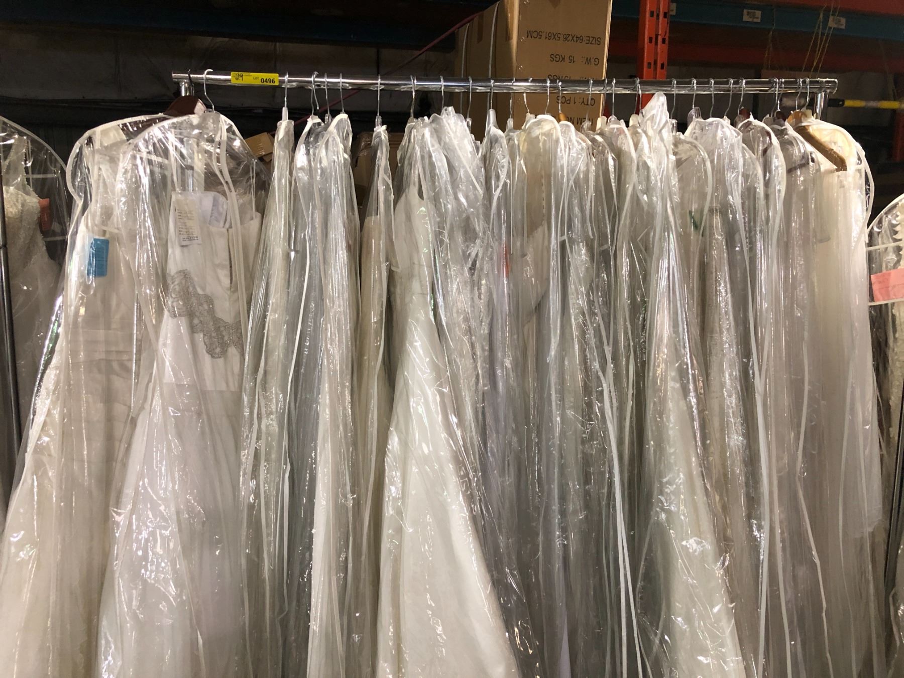 Rack full of assorted wedding dresses/ gowns from wedding store closure ...