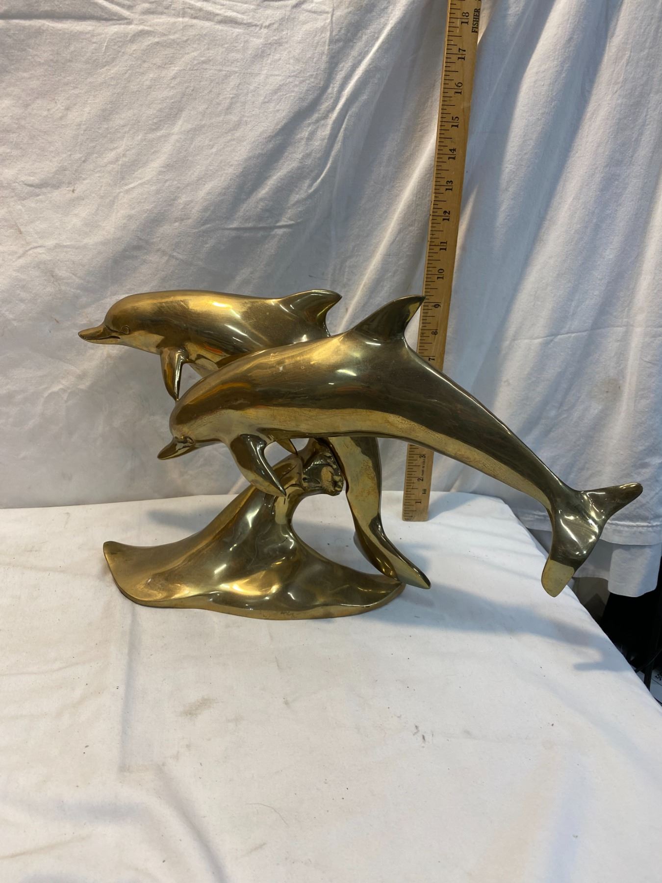 Brass dolphins