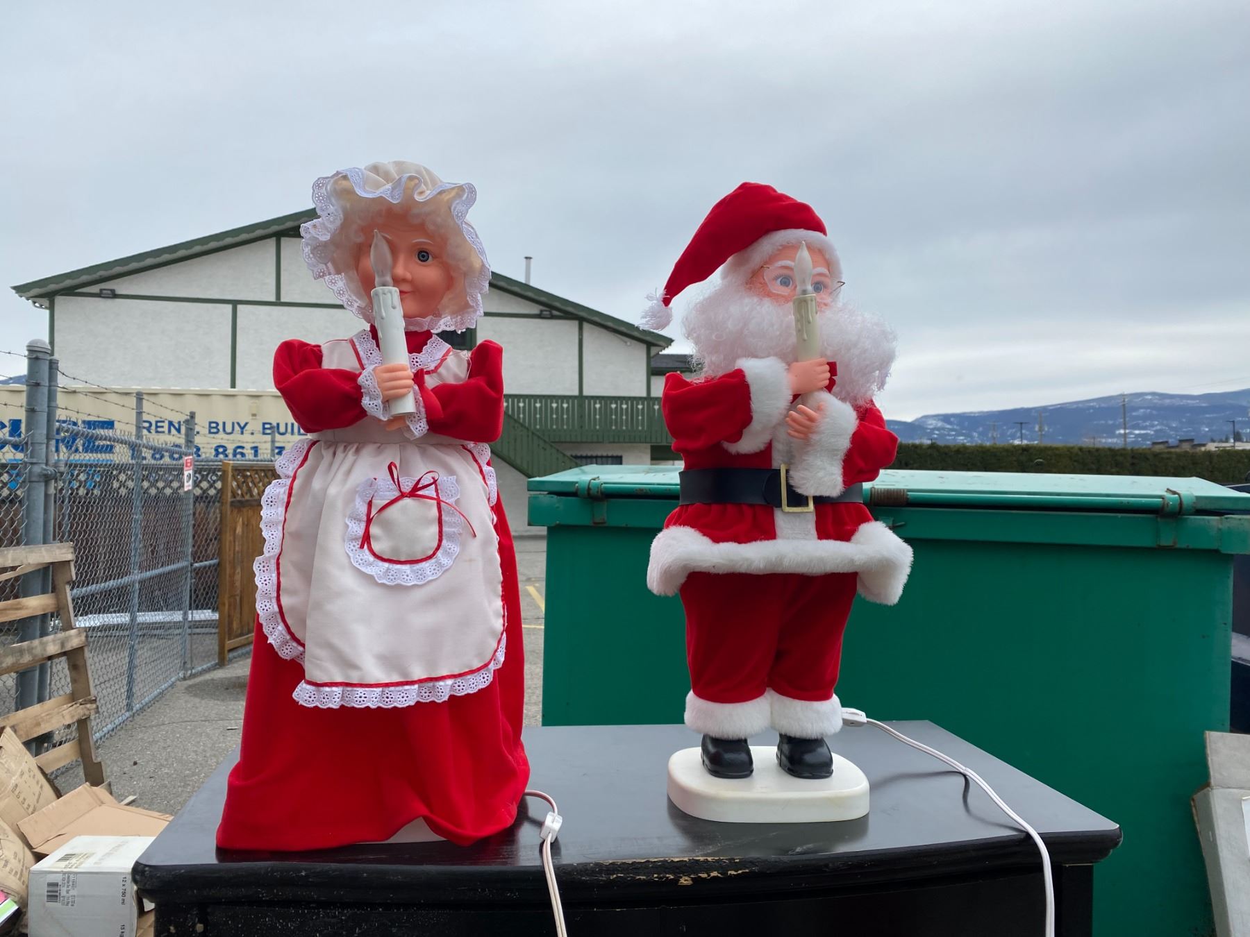 Santa and Mrs. Clause with boxes