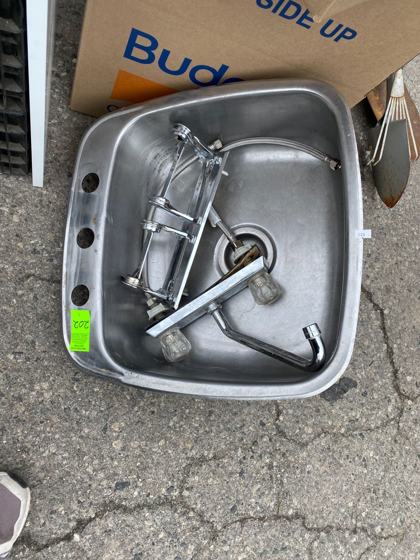 Sink and taps toilet paper roll holder