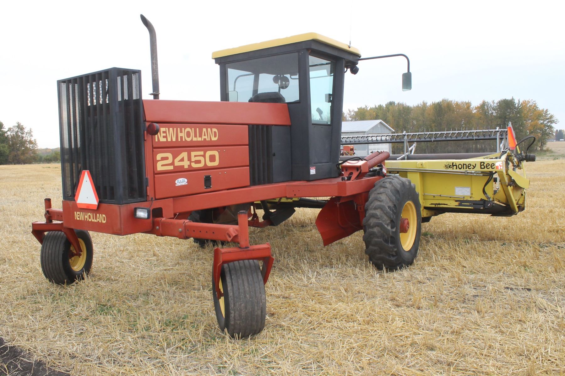 1999 New Holland 2450 Swather. Honeybee 18' Header, U2 Pickup Reels ...
