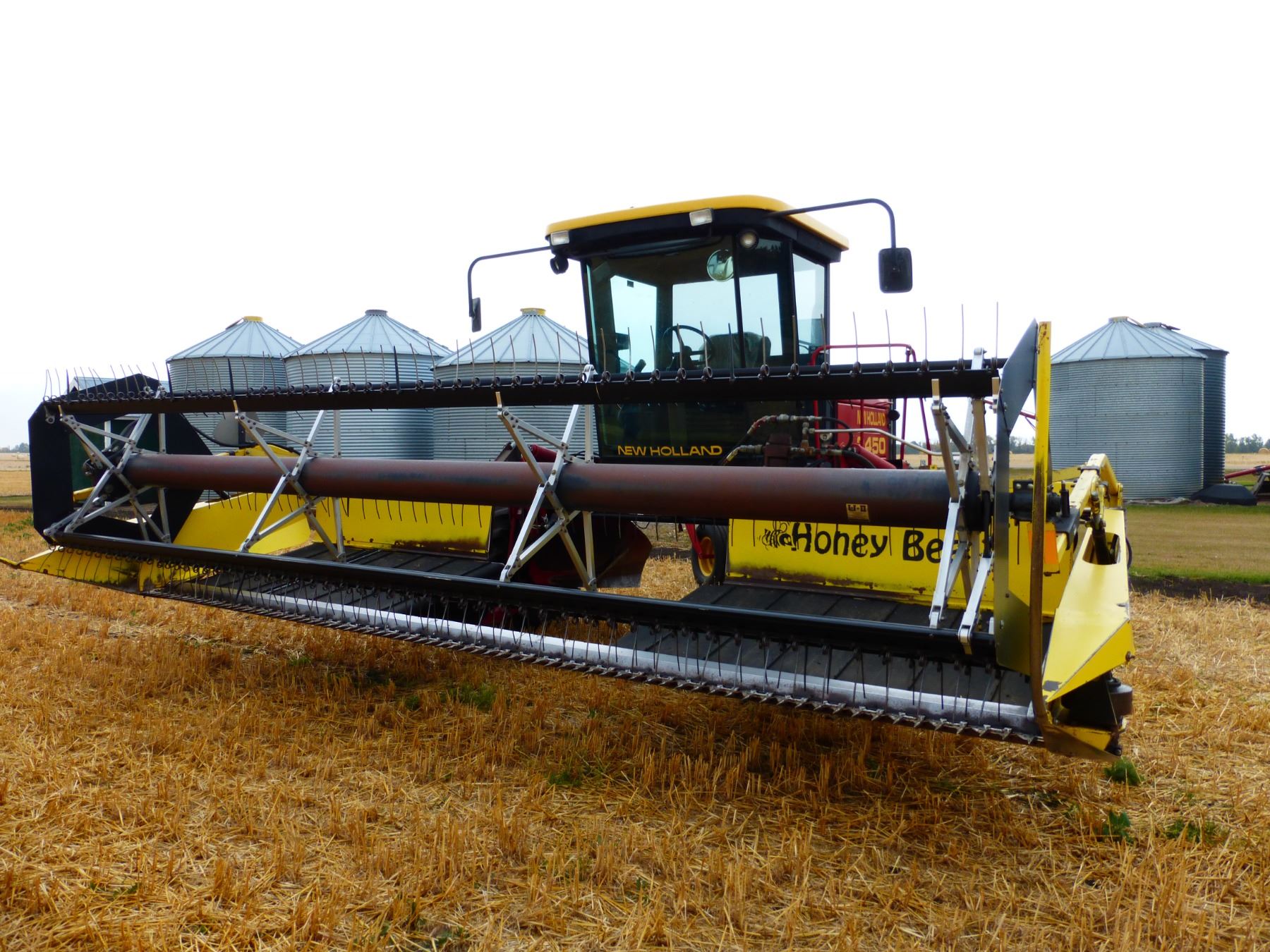 1999 New Holland 2450 Swather. Honeybee 18' Header, U2 Pickup Reels ...