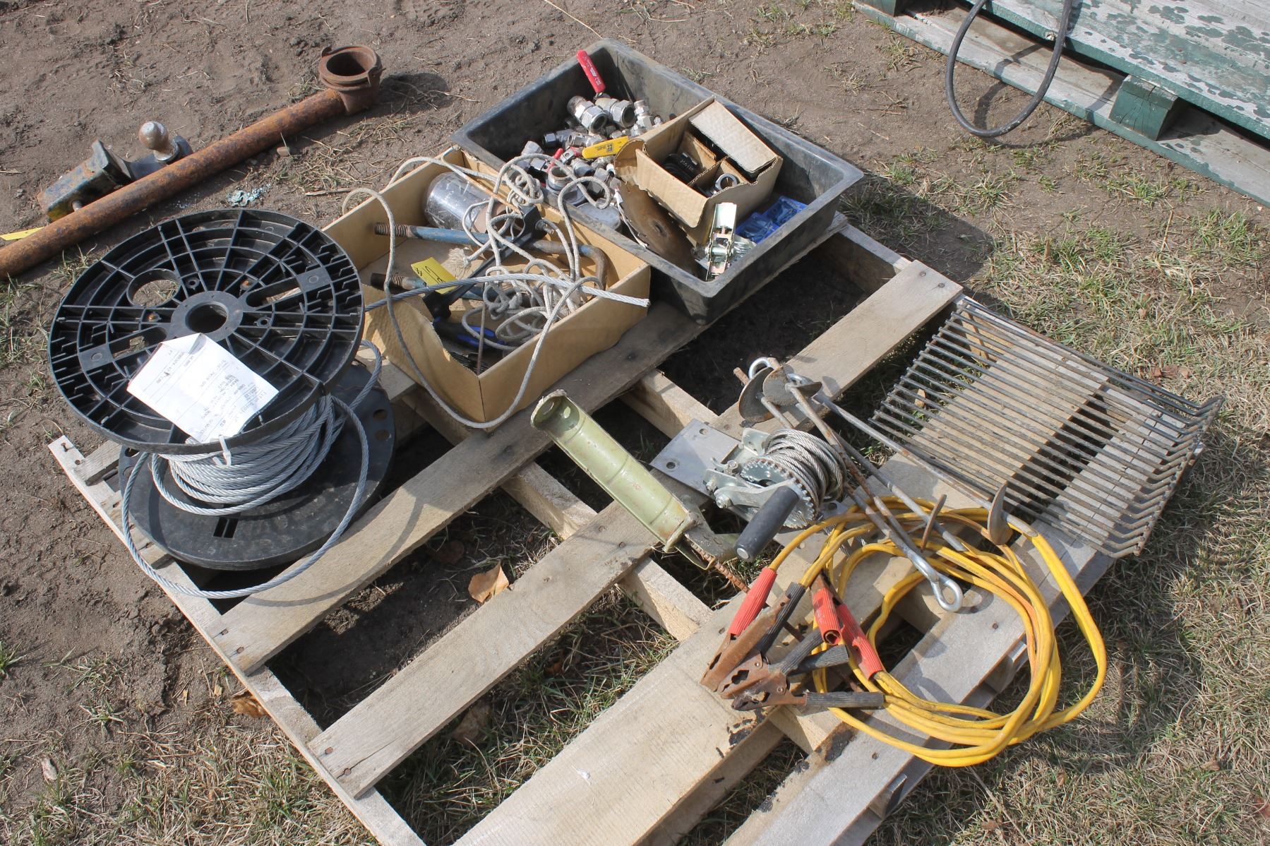 Pallet of valves, spool of cable, winch and booster cables