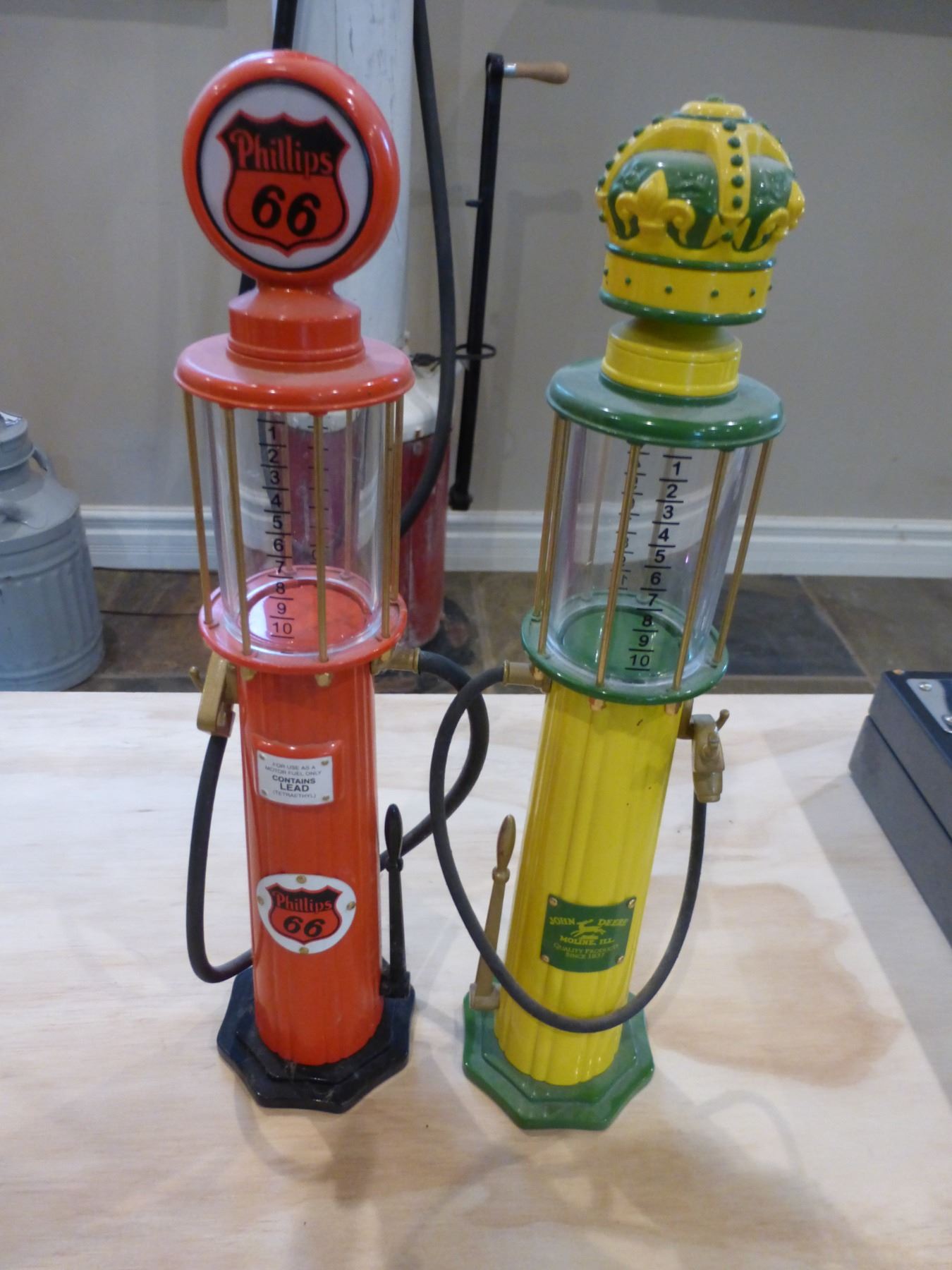 12" JD visible gas pump and 12" Phillips 66 visible gas pump