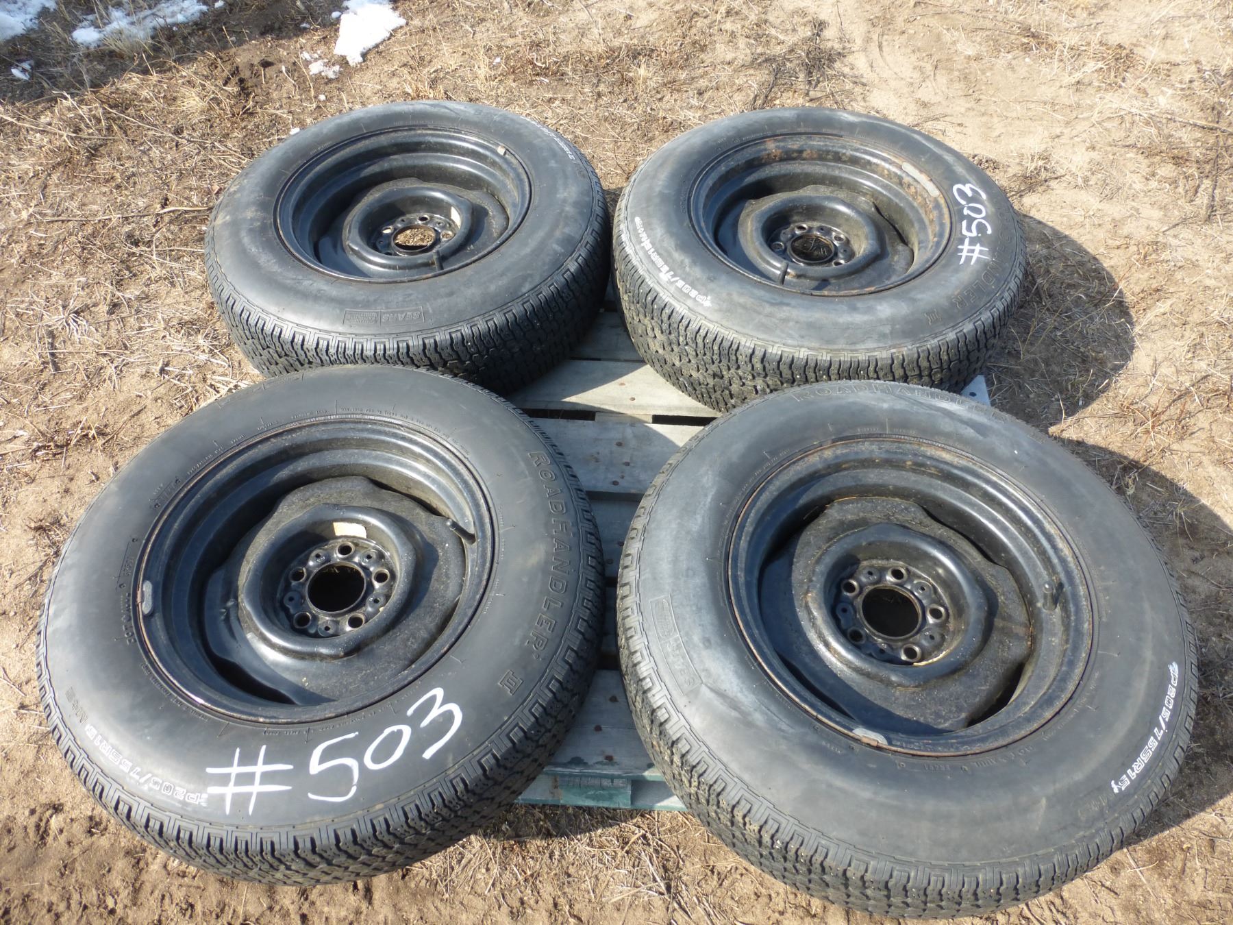 4- P205/75R15 tires & rims (which fit the 87 Jeep)