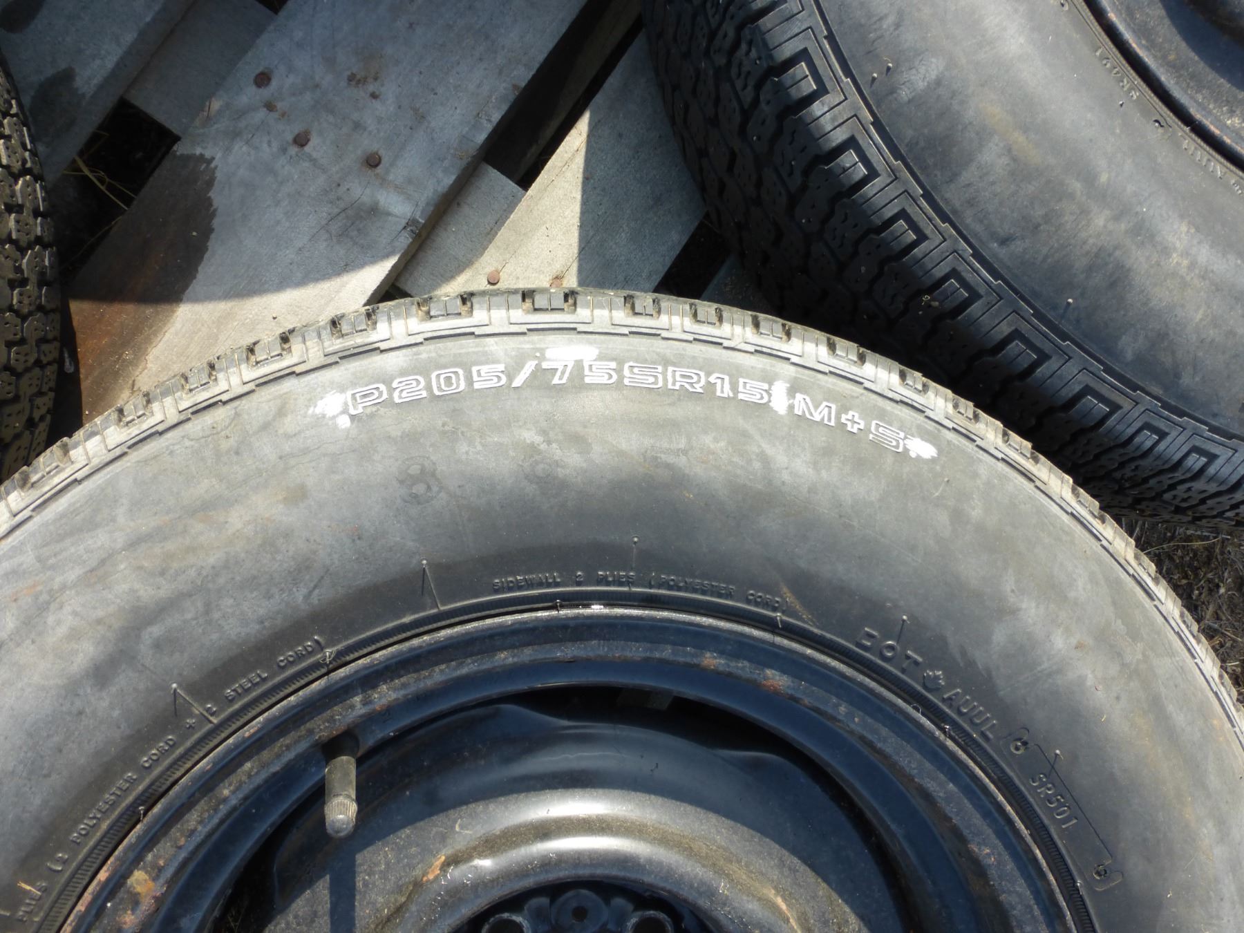 4- P205/75R15 tires & rims (which fit the 87 Jeep)