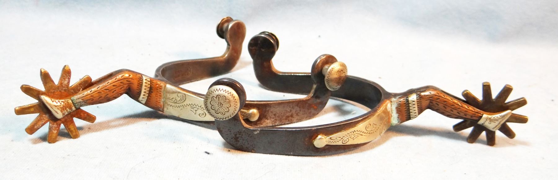Hand forged gal leg spurs, silver and copper mtd., stamped Winchester ...