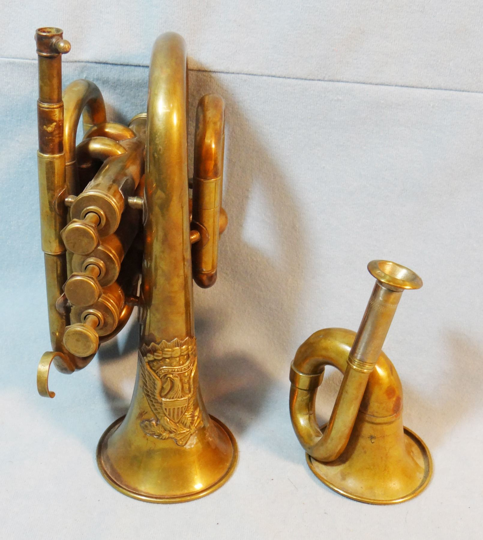 Small brass bugle/trumpet, 9 ½" long w/ Cavalry insignia embossed on ...