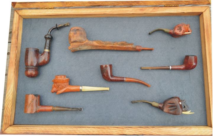 frame of 7 antique tobacco pipes