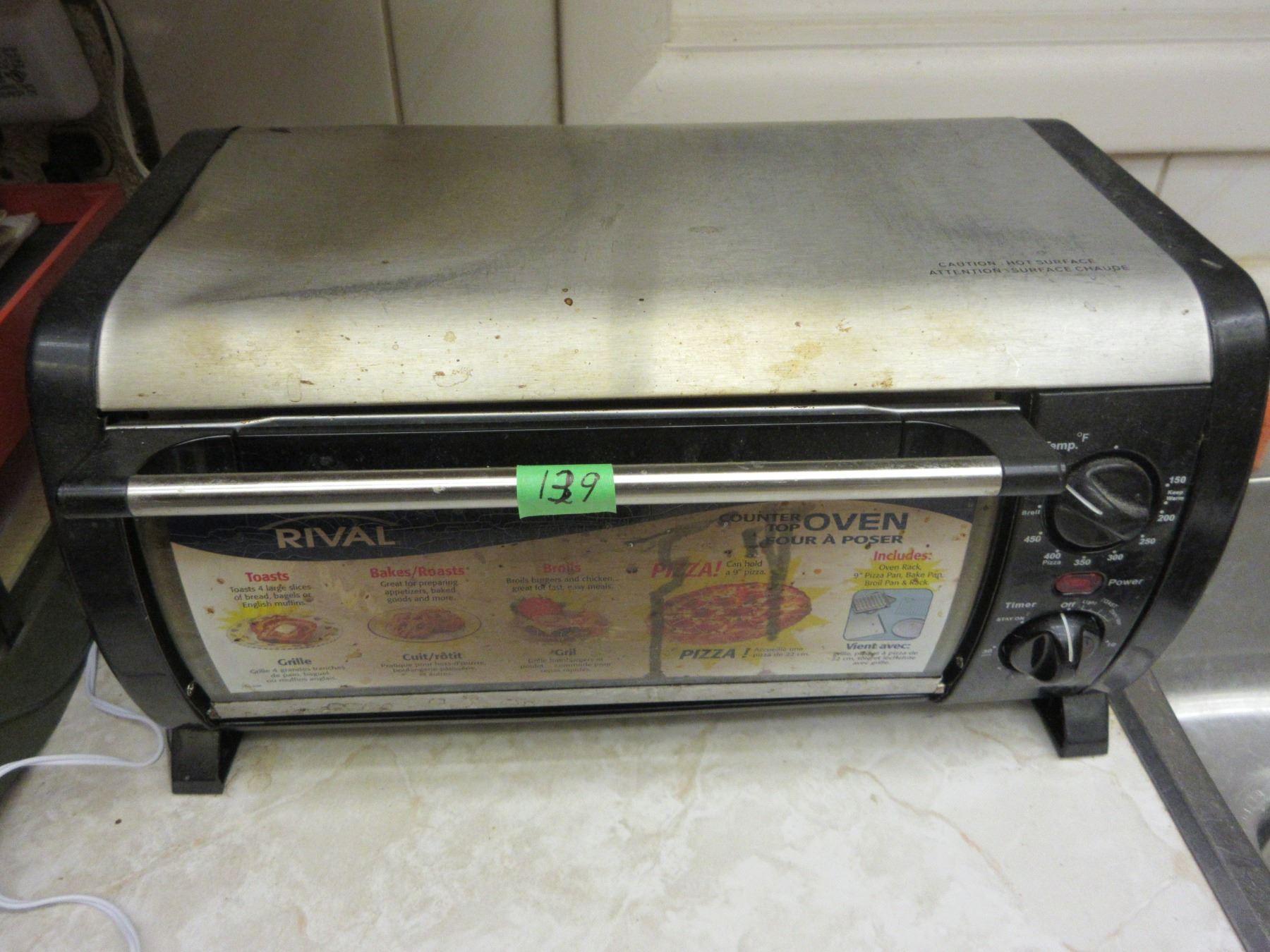 KITCHEN: RIVAL TOASTER OVEN, OFFICE SUPPLIES, PHONE, MASSAGER