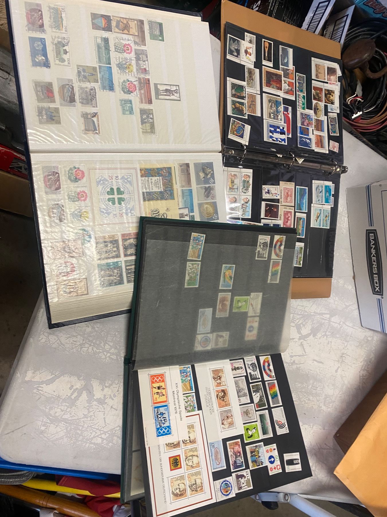 3 stamp books with stamps