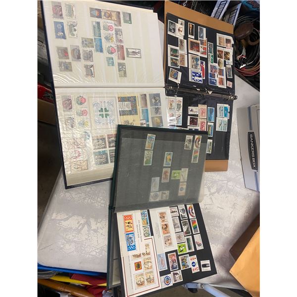 3 stamp books with stamps