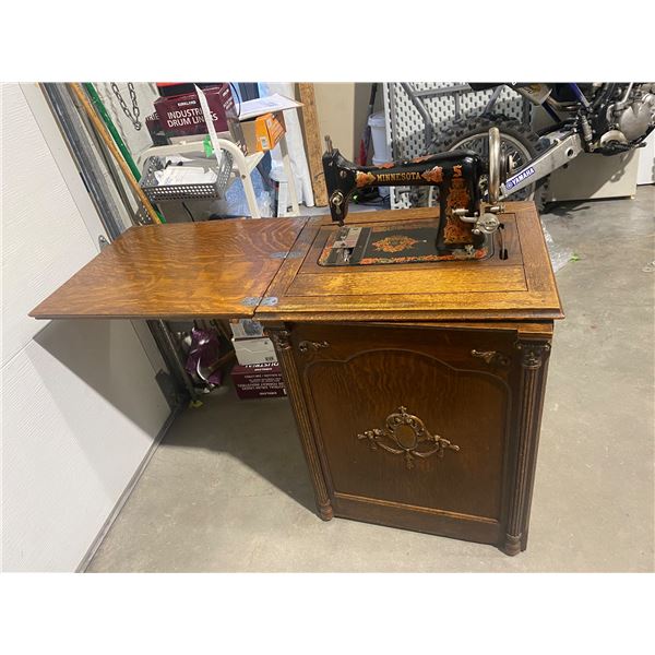 Minnesota Sewing Machine in Oak Cabinet