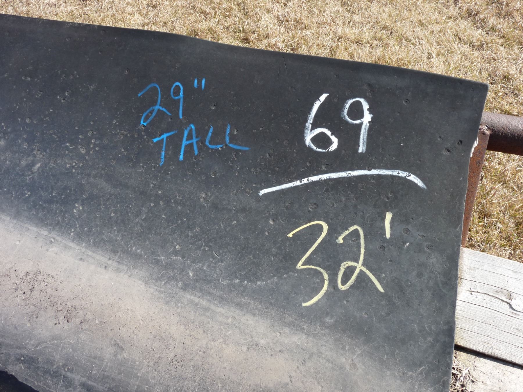 Heavy duty feed trough lined with belting