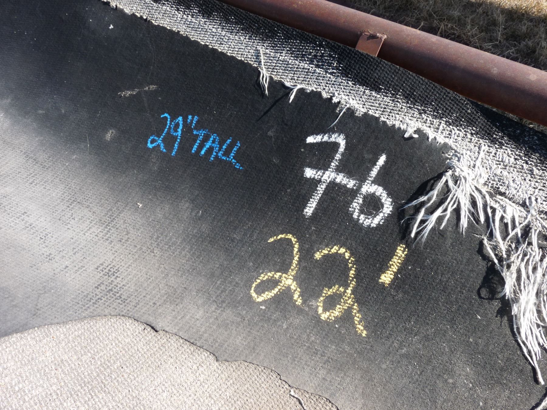 Heavy duty feed trough lined with belting