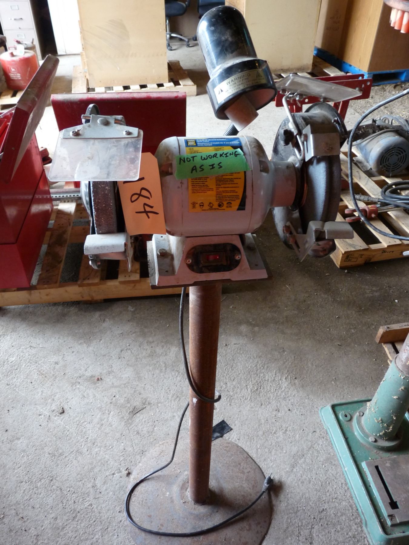 Power fist bench grinder on stand . Has issues not working broken base