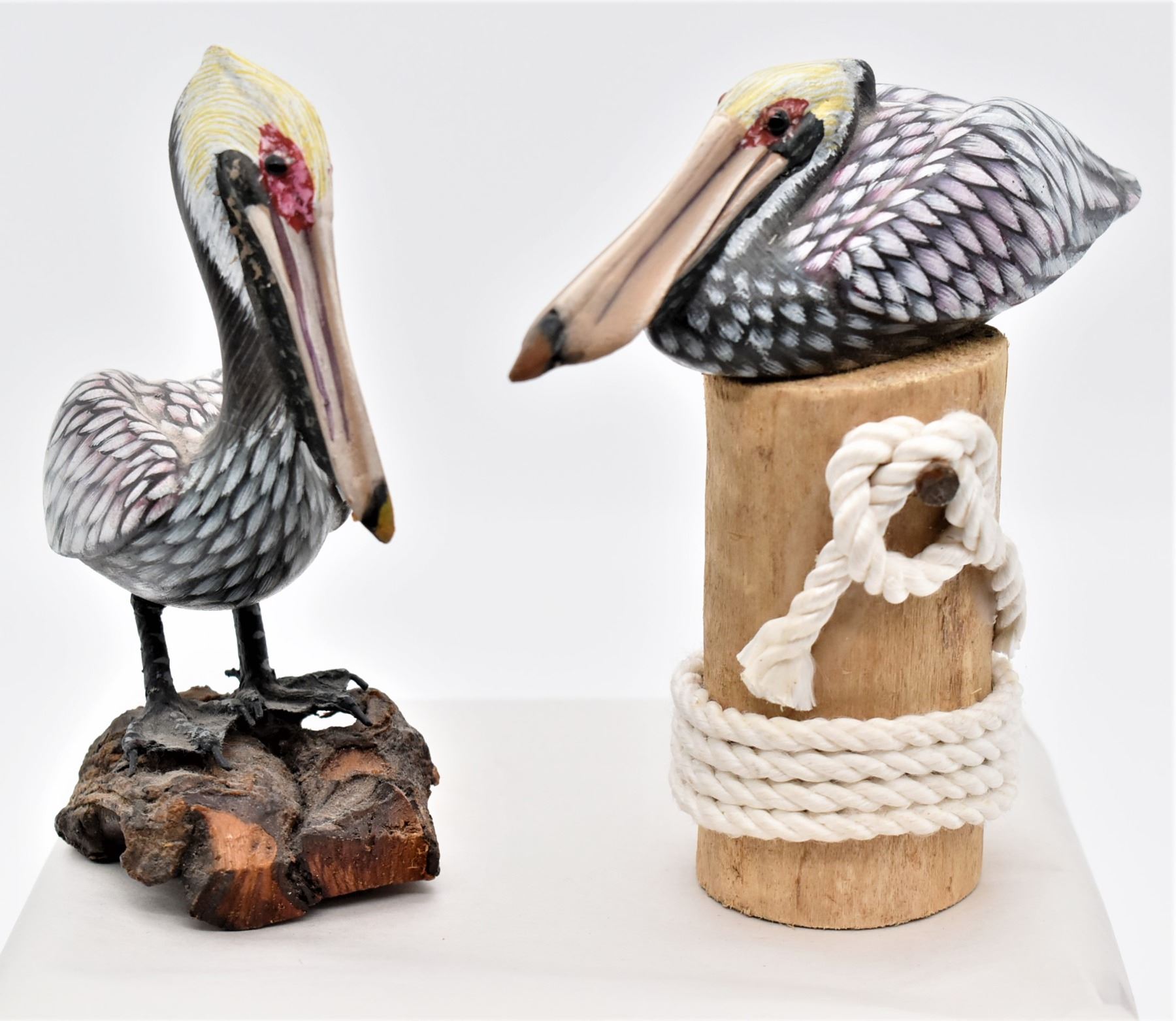 2 Carved Wood Pelican Figurines