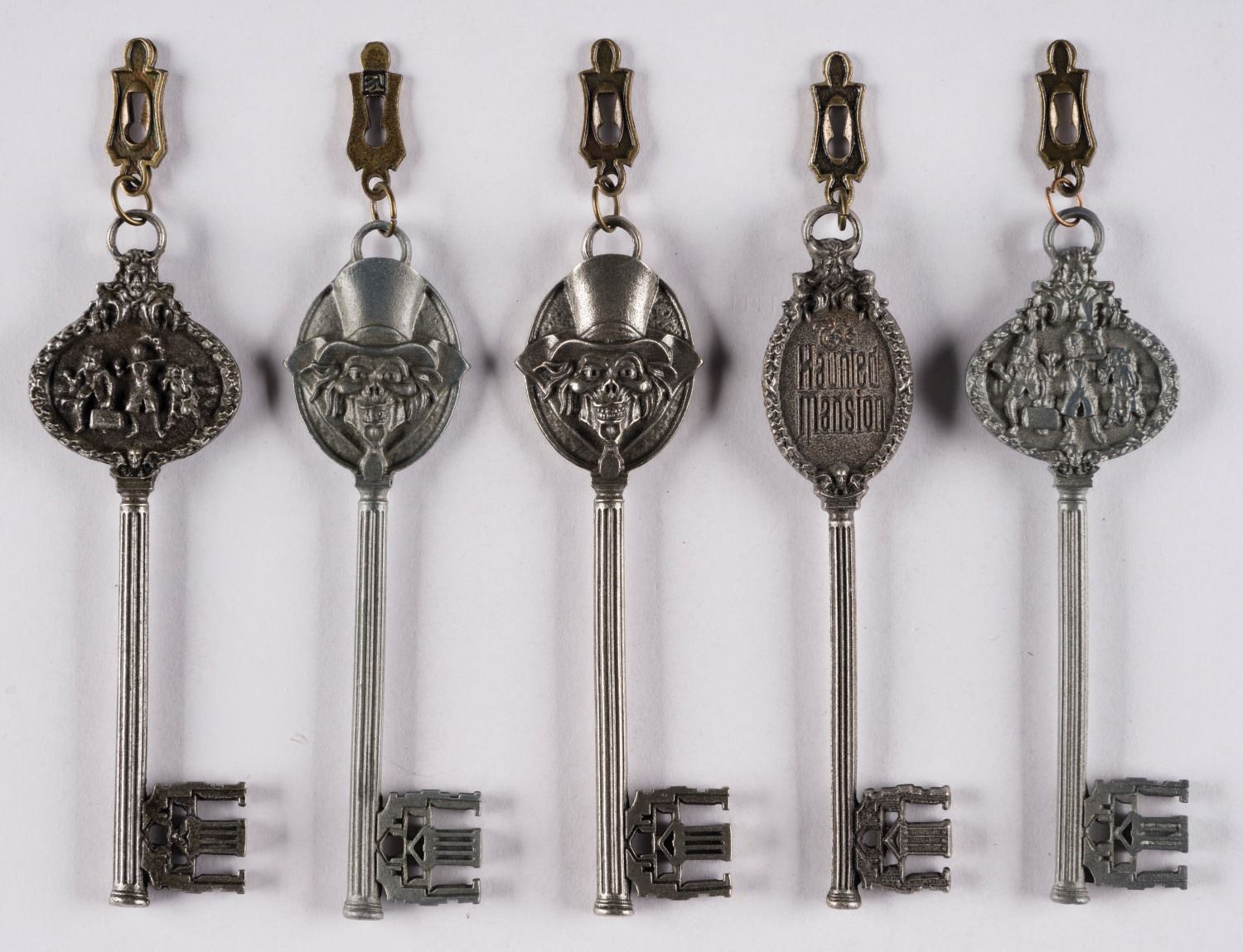 A Collection of (5) Haunted Mansion Keys.