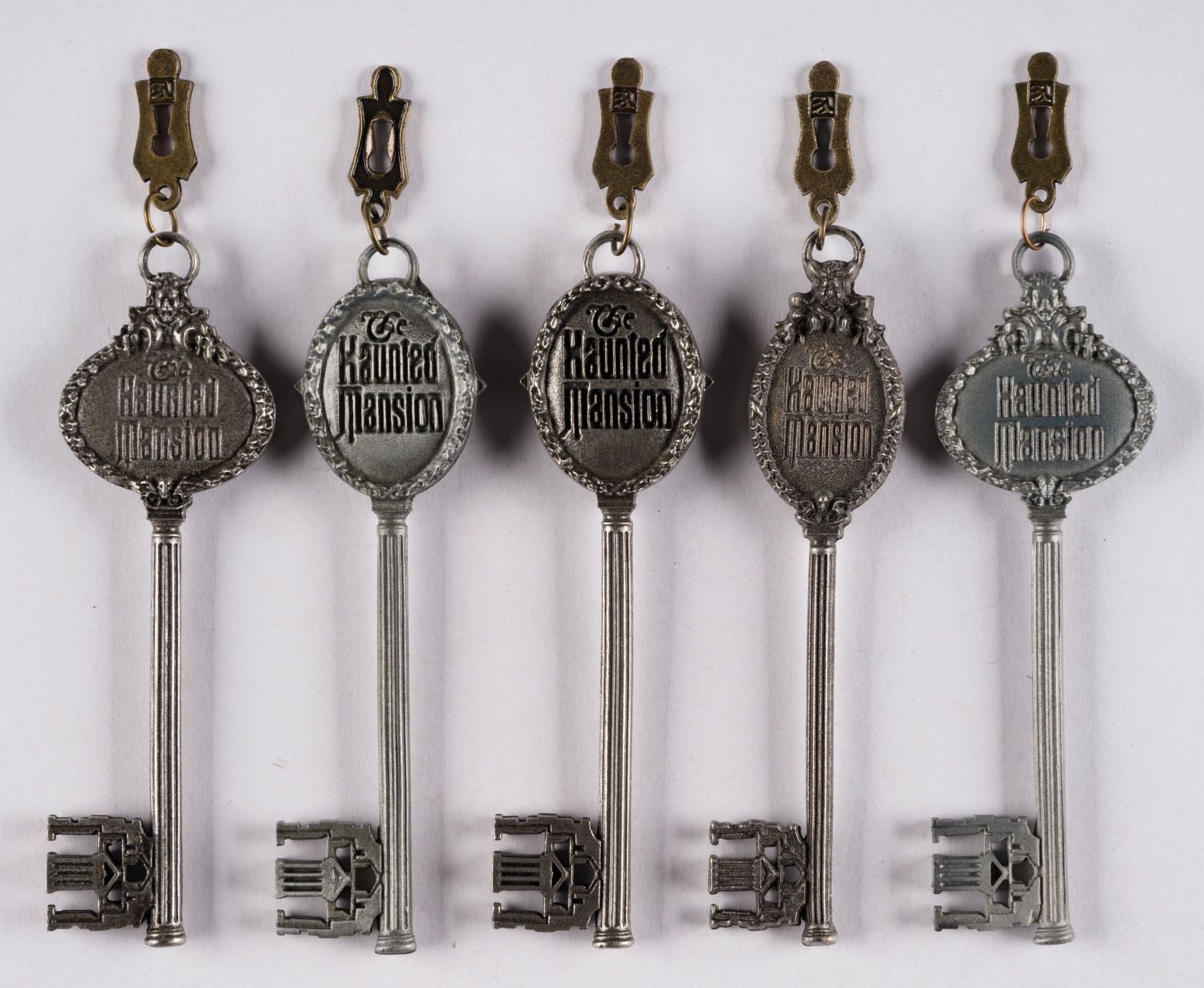 A Collection of (5) Haunted Mansion Keys.