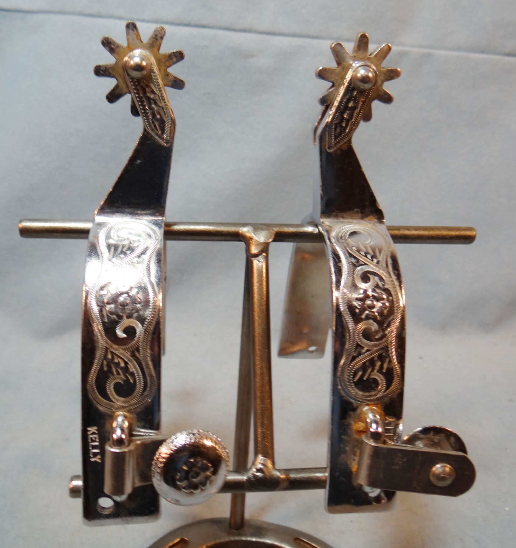 8 pieces: Kelly drop shank spurs, newer, 2 iron bits, 2 wooden stirrups ...