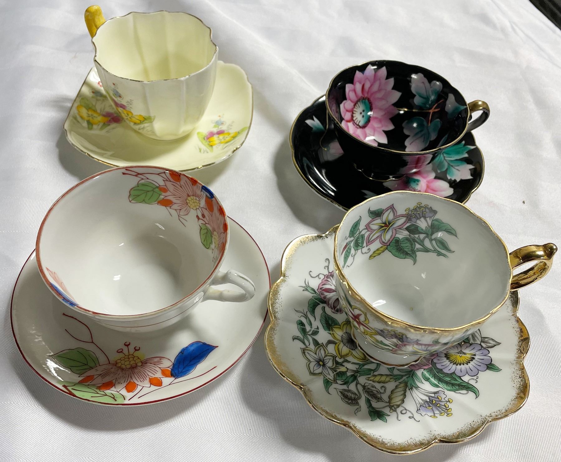 Four Tea Cups and Saucers
