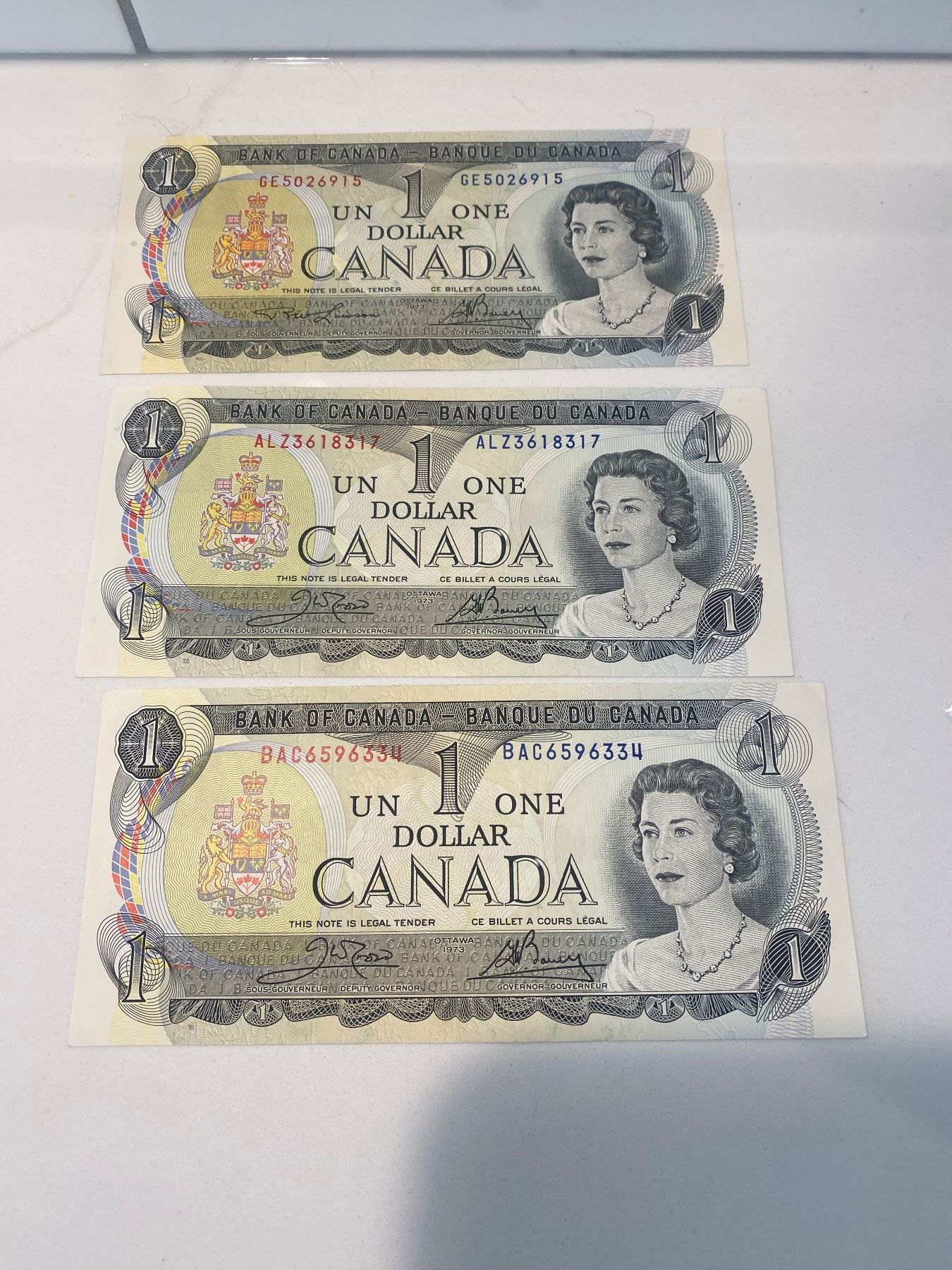 3 Canada $1 bills