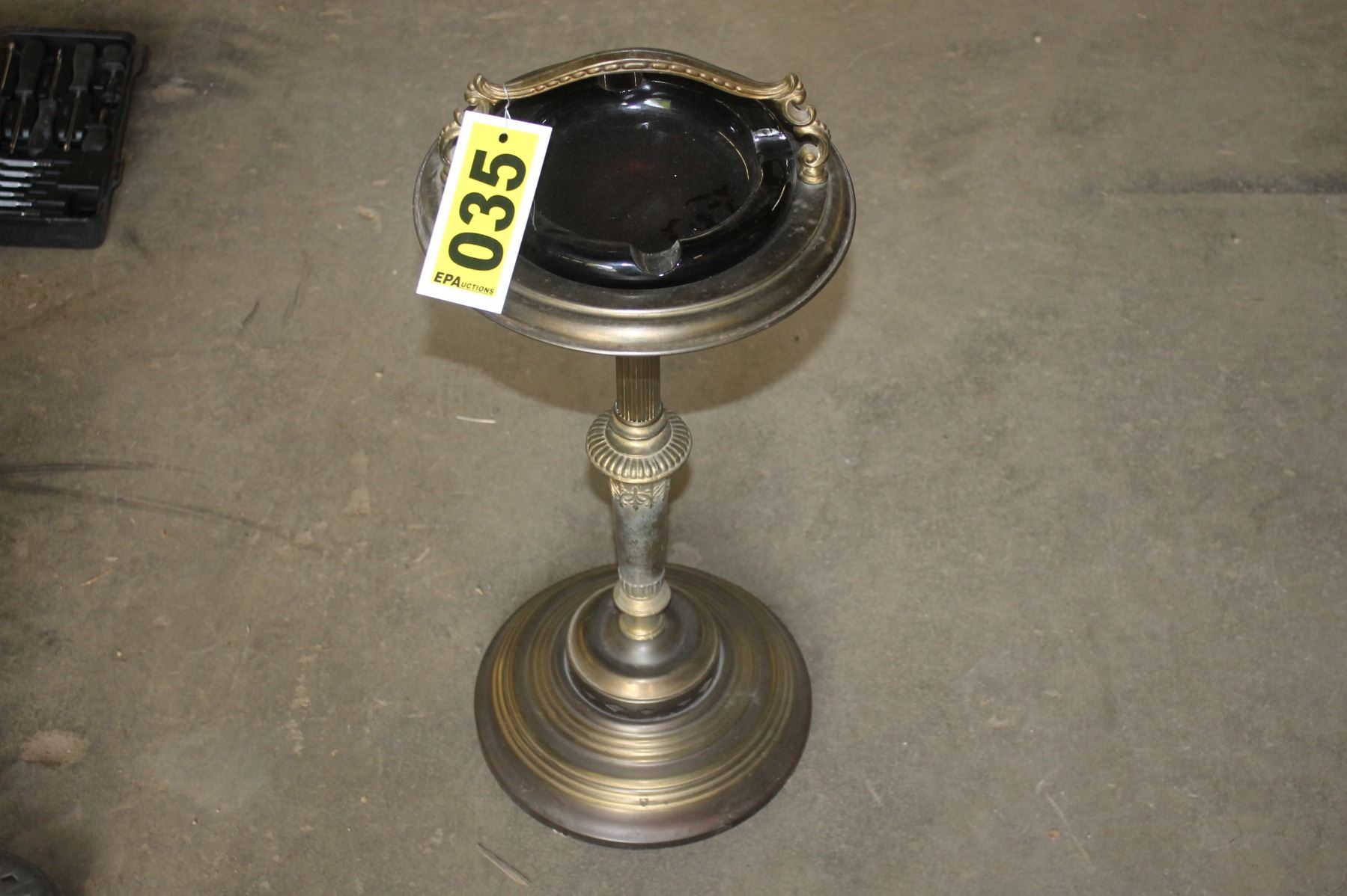 Old standing ashtray.